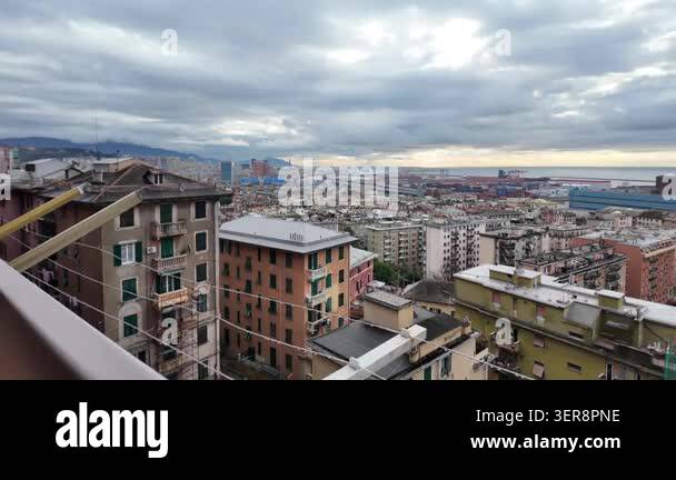 An expansive high-angle view of Genoa, Italy, revealing dense ...