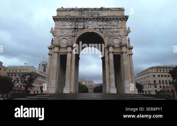 A drone shot approaches and passes through the majestic Arch of Victory ...