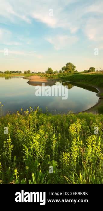 Early morning on Elbe River in Germany. Winding riverbank glowing in ...