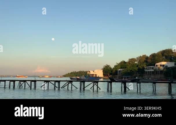 4K scenic view of Tanjung Lesung Beach, Banten, Indonesia with wooden ...