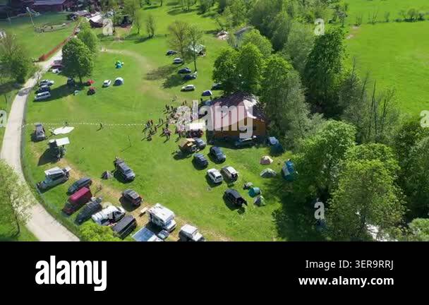 Aerial drone view of an outdoor campsite festival gathering Stock Video ...