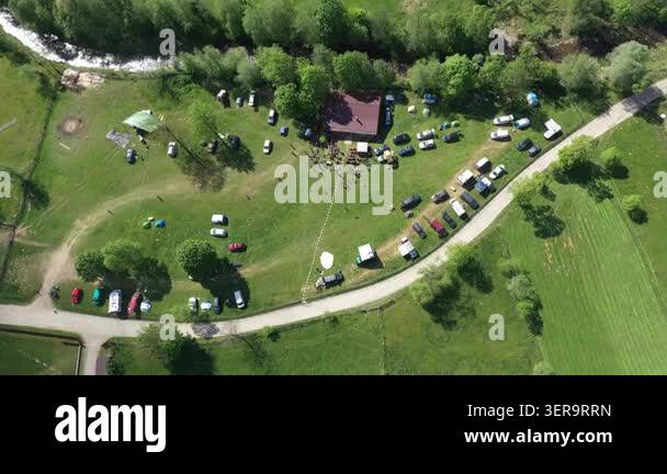 Aerial drone view of an outdoor campsite festival gathering Stock Video ...