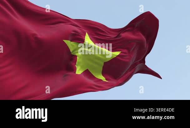 Close up of the national flag of Vietnam with a gold star on a red ...