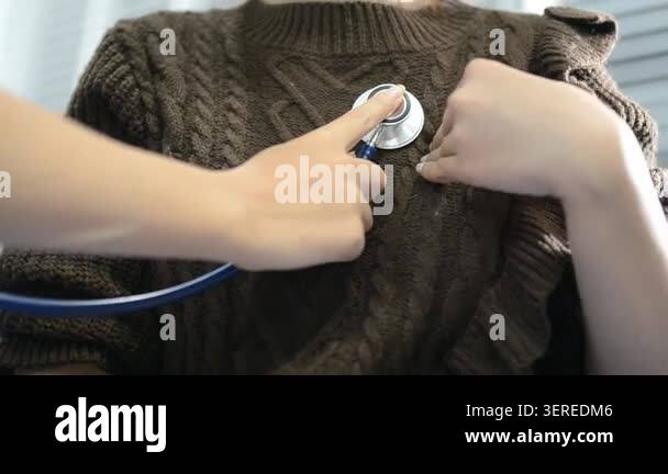 doctor checking a patient 's pulse Stock Video Footage - Alamy