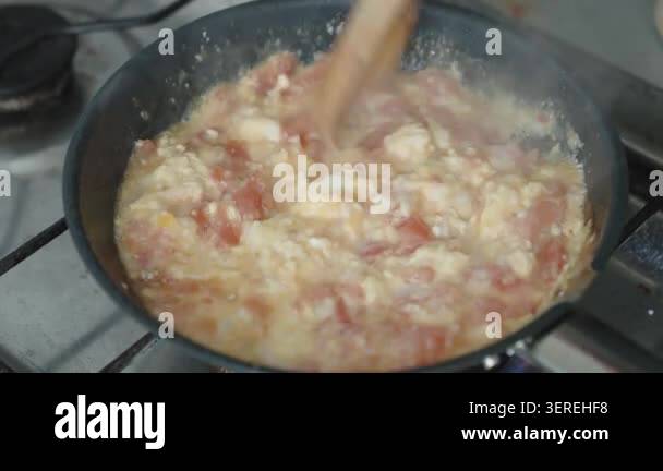 Eggs Cooking in Tomato Sauce in Skillet. High quality 4k footage Stock ...