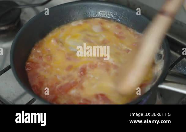 Eggs Cooking in Tomato Sauce in Skillet. High quality 4k footage Stock ...