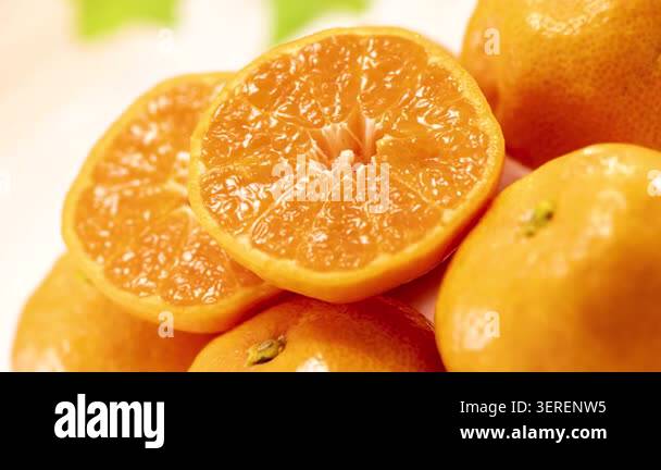 Fresh sliced mandarin oranges showing juicy cross section on white ...