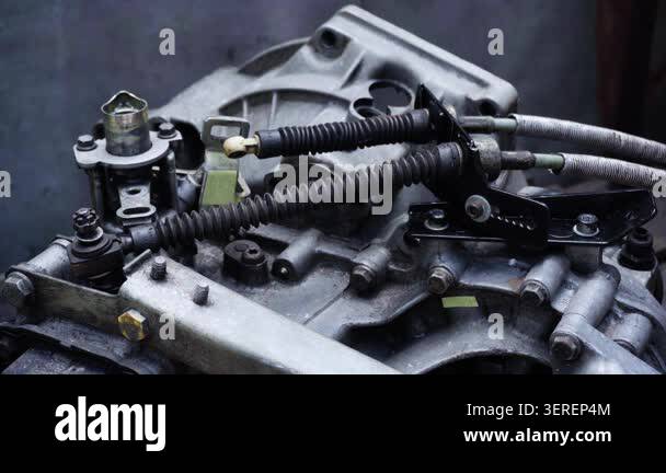 old gear shift box from a front-wheel drive car installing cables and ...