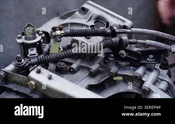 old gear shift box from a front-wheel drive car installing cables and ...