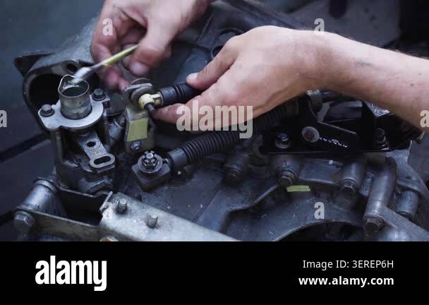 old gear shift box from a front-wheel drive car installing cables and ...