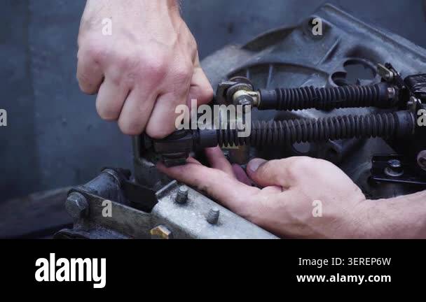 old gear shift box from a front-wheel drive car installing cables and ...