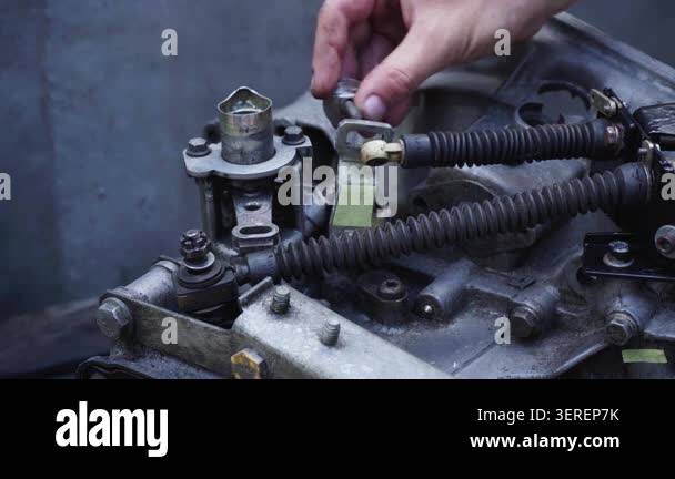 old gear shift box from a front-wheel drive car installing cables and ...
