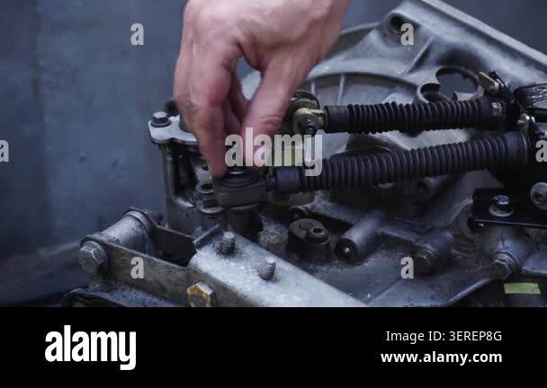 old gear shift box from a front-wheel drive car installing cables and ...