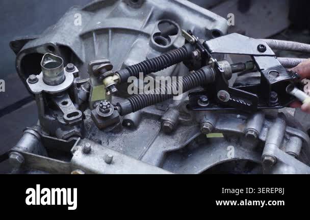 old gear shift box from a front-wheel drive car installing cables and ...