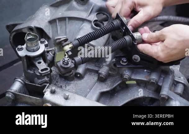 old gear shift box from a front-wheel drive car installing cables and ...