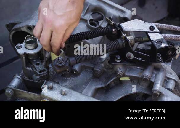 old gear shift box from a front-wheel drive car installing cables and ...