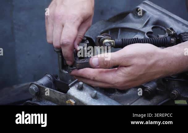 old gear shift box from a front-wheel drive car installing cables and ...
