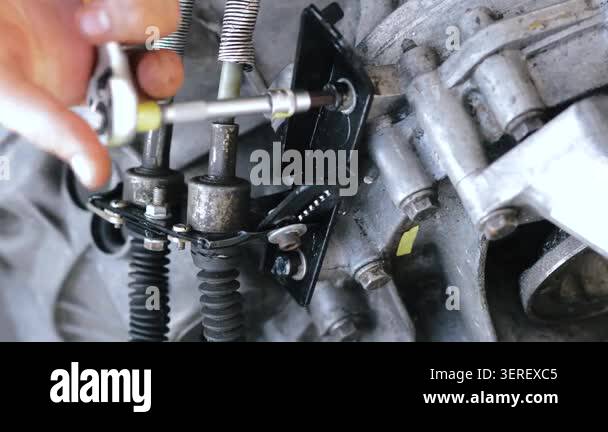 old gear shift box from a front-wheel drive car installing cables and ...