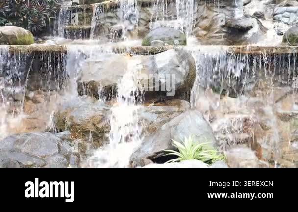 Small Waterfall Flowing Over Rocks in a Garden at Munnar Kerala Stock ...