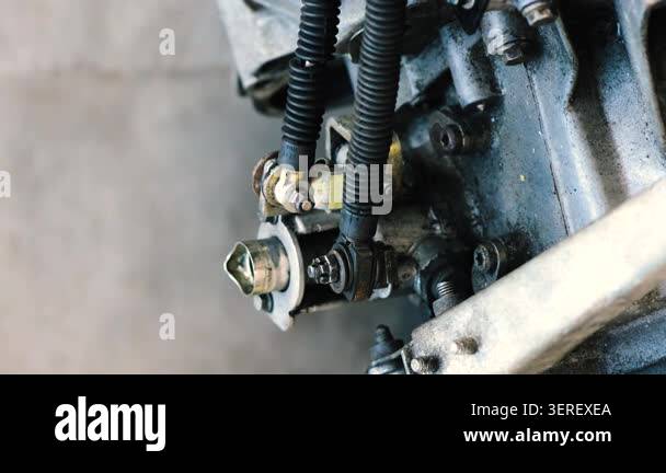 old gear shift box from a front-wheel drive car installing cables and ...