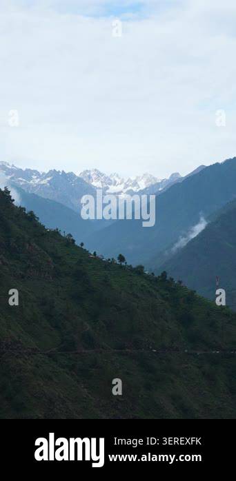 A picturesque Himalayan village nestled in lush green valleys, with ...