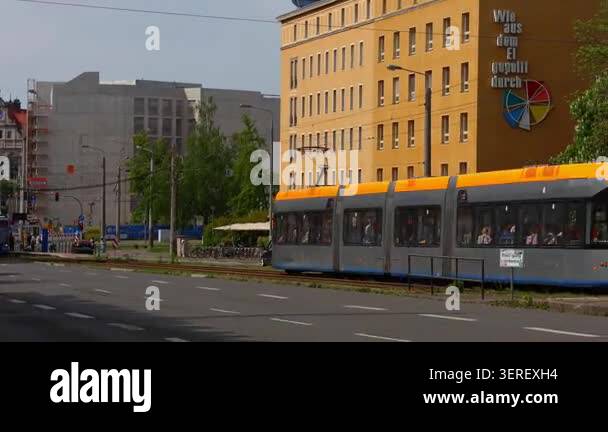 Leipzig, Germany, May 2, 2026: Urban tram moves along the street past a ...
