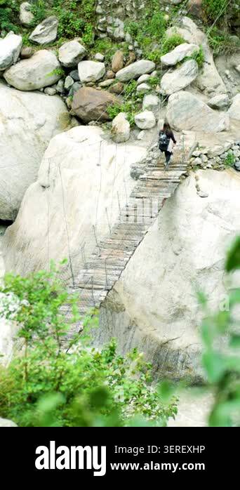 scenic himalayan trail with weathered stone steps surrounded by rocks ...