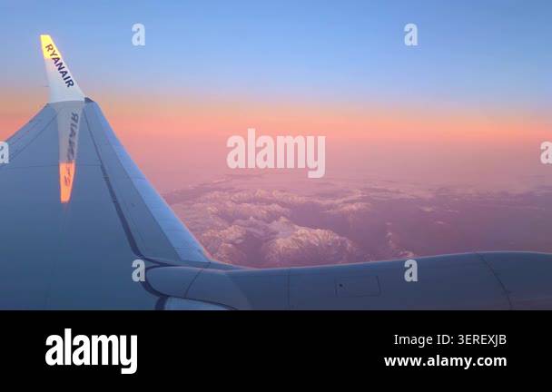 Wroclaw, Poland, April 12, 2025: Airplane wing with airline logo flying ...