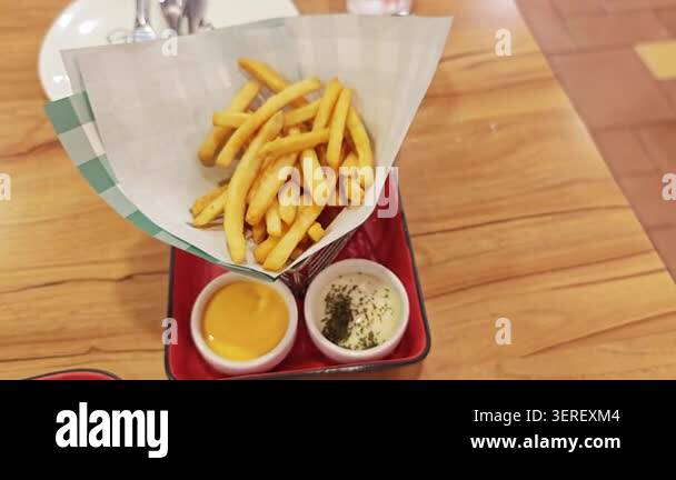 Crispy french fries with dipping sauces Stock Video Footage - Alamy