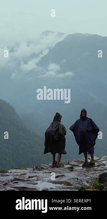 Silhouetted trekkers journey through foggy mountain paths in Garhwal ...