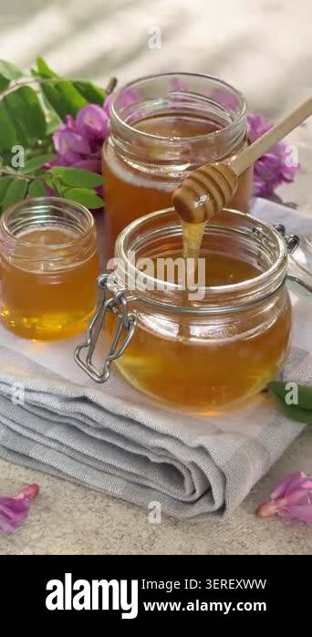 Fresh acacia flower honey jar still life Stock Video Footage - Alamy