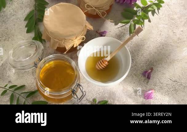 Fresh acacia flower honey jar still life Stock Video Footage - Alamy