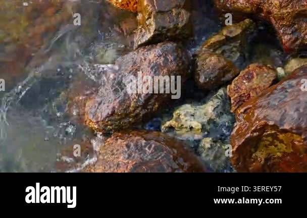 Ocean waves crashing against coastal rocks, dynamic seaside video ...