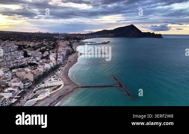 Aerial Turquoise Bay At Dusk Town, Curved Beach, Protective Pier ...