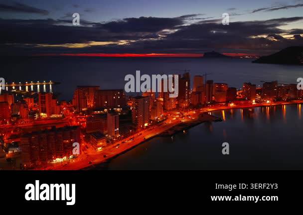 Moody Coastal Skyline At Dusk, Aerial View Of Glowing Streetlights ...