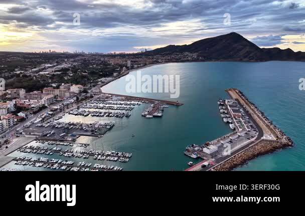 Calm Marina Bay With Moored Boats And Curved Pier, Breakwater ...