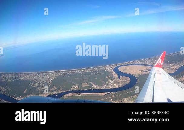 JURMALA, LATVIA - APRIL 30, 2022: A 4K aerial passenger-window view of ...