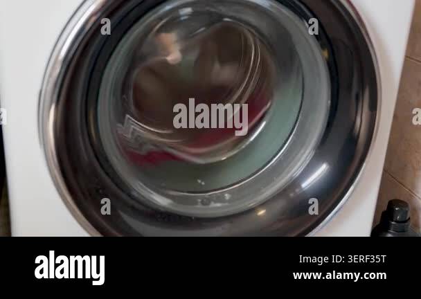 washing machine spinning drum front view, laundry cycle background for ...