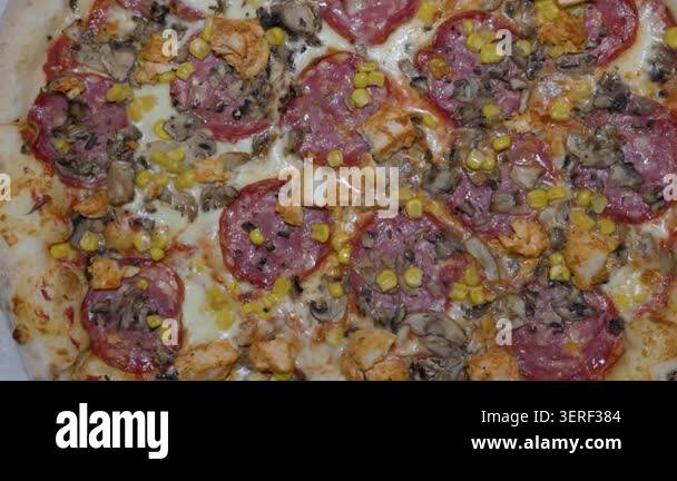 pizza toppings overhead close up for food background with melted cheese ...