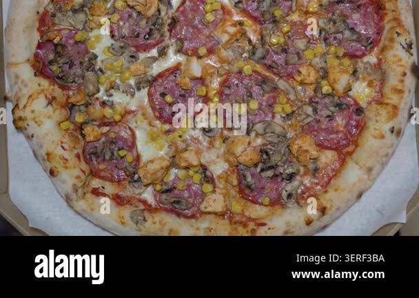 whole pizza overhead view for food advertising with salami mushrooms ...