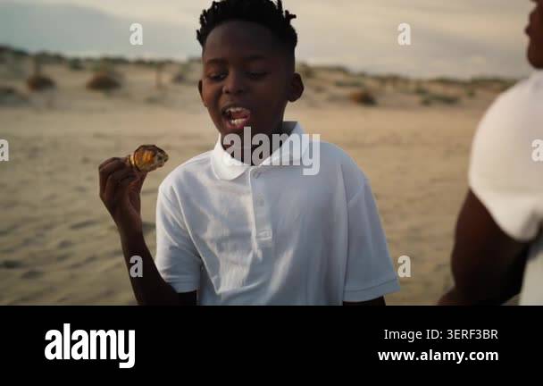african - american man eating hamburger Stock Video Footage - Alamy