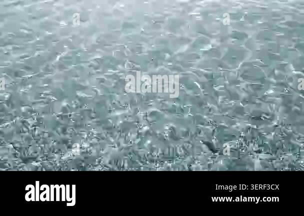 Clean transparent water on shallow sandy seashore with shells with ...