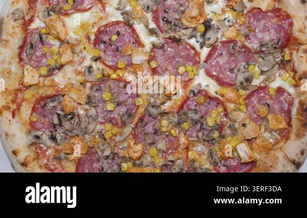 whole pizza top view for restaurant advertising with salami mushrooms ...