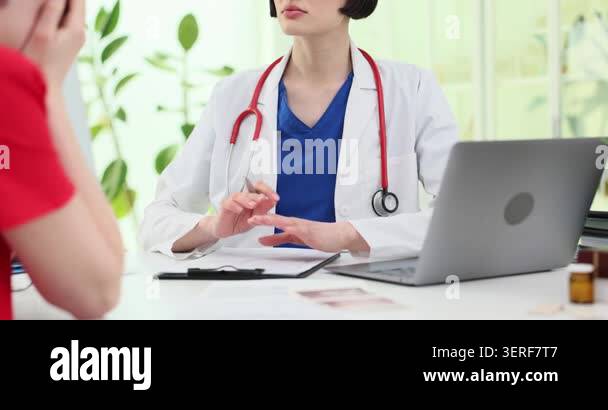 Woman doctor listens to upset patient at clinic consultation ...