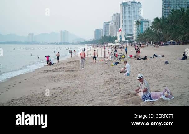 Nha Trang Vietnam. 01 06 2026 Wide sandy shoreline with many people ...