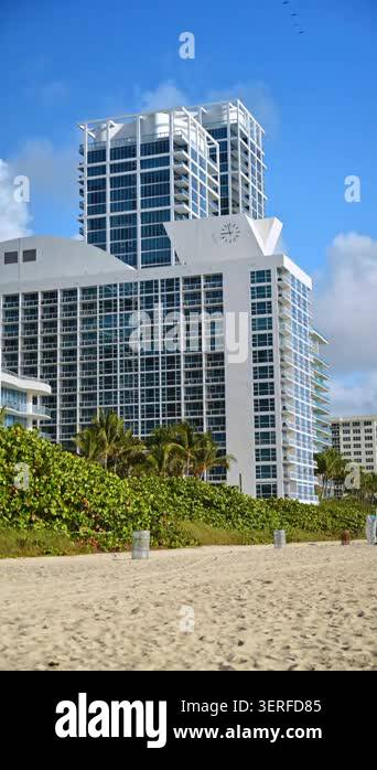 Ground level view of a modern beach hotel, Miami, Florida. Vertical ...