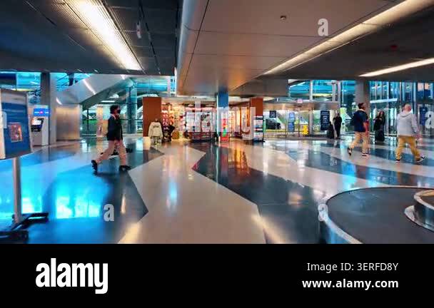Chicago, USA, 7 May 2026: Travelers waiting at baggage carousel in ...