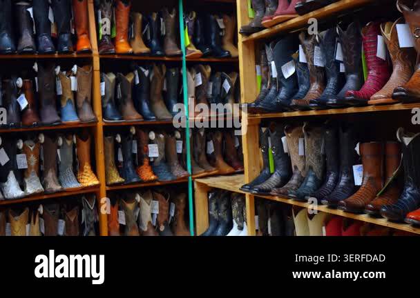 Chicago, USA, 7 May 2026: Shelves of exotic leather cowboy boots in ...