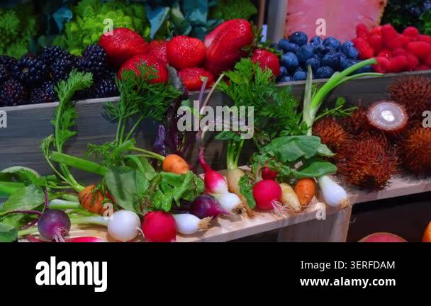 Fresh radishes and berries at a market display, Chicago, Illinois ...