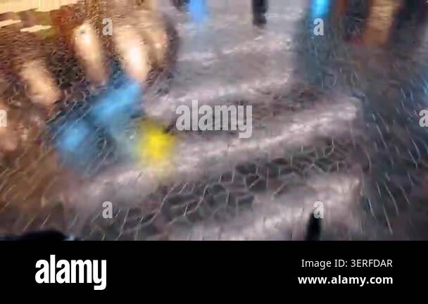 Reflective hexagonal floor tiles with blurred lights in airport ...